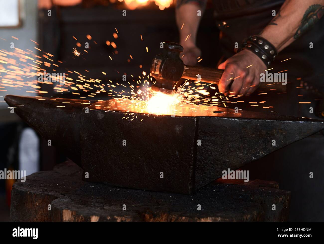 Side view faceless male blacksmith hi-res stock photography and images ...
