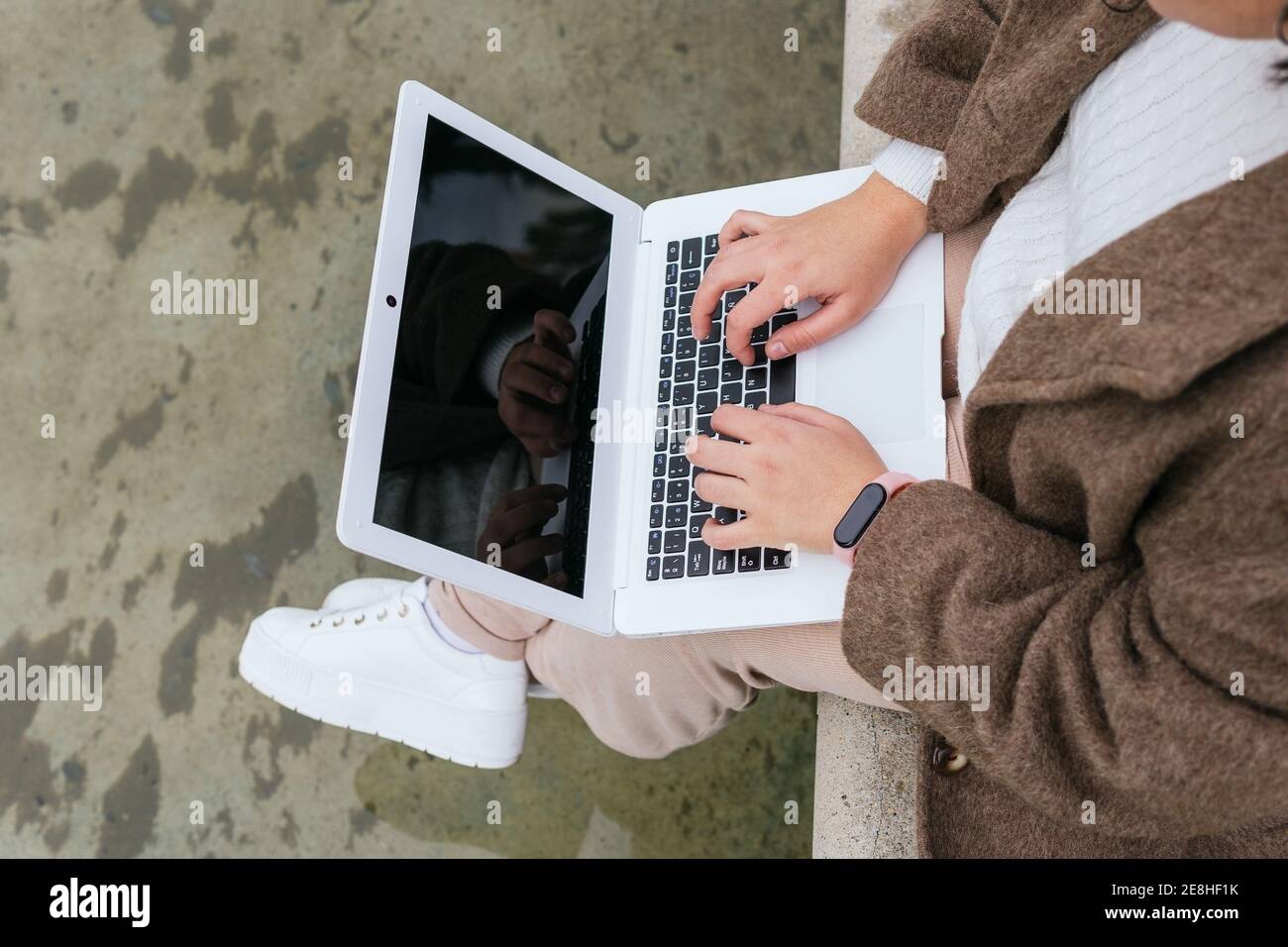 From above side view of crop anonymous plus size female surfing ...