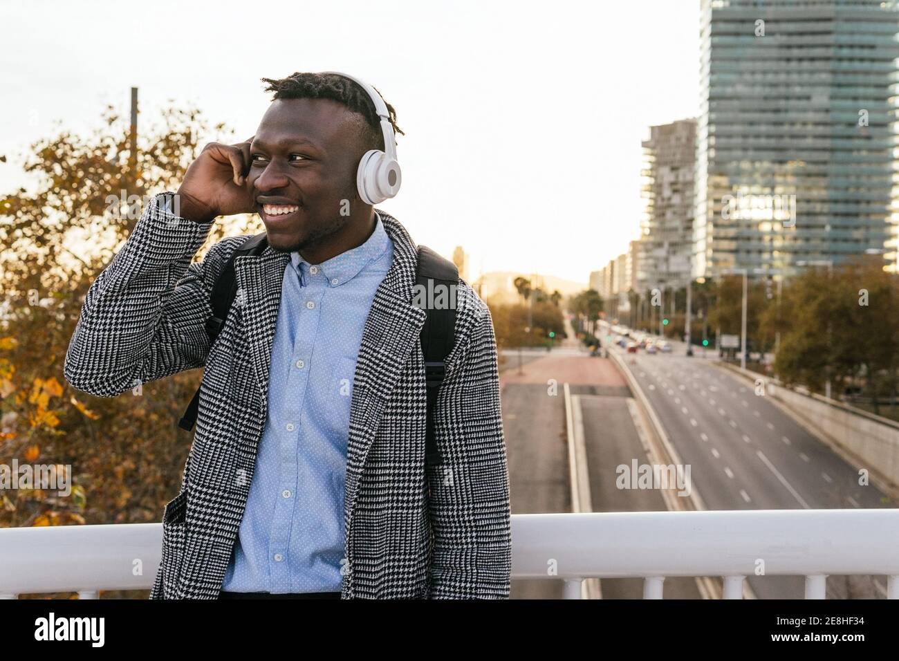 Young cheerful African American male office worker in formal wear ...