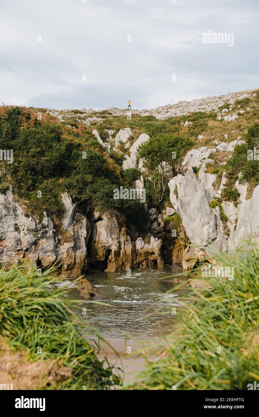 Picturesque view of distance unrecognizable person standing on top of ...