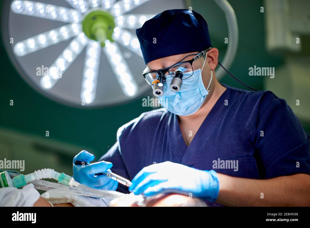 Unrecognizable male doctor in medical uniform and magnifying glasses ...