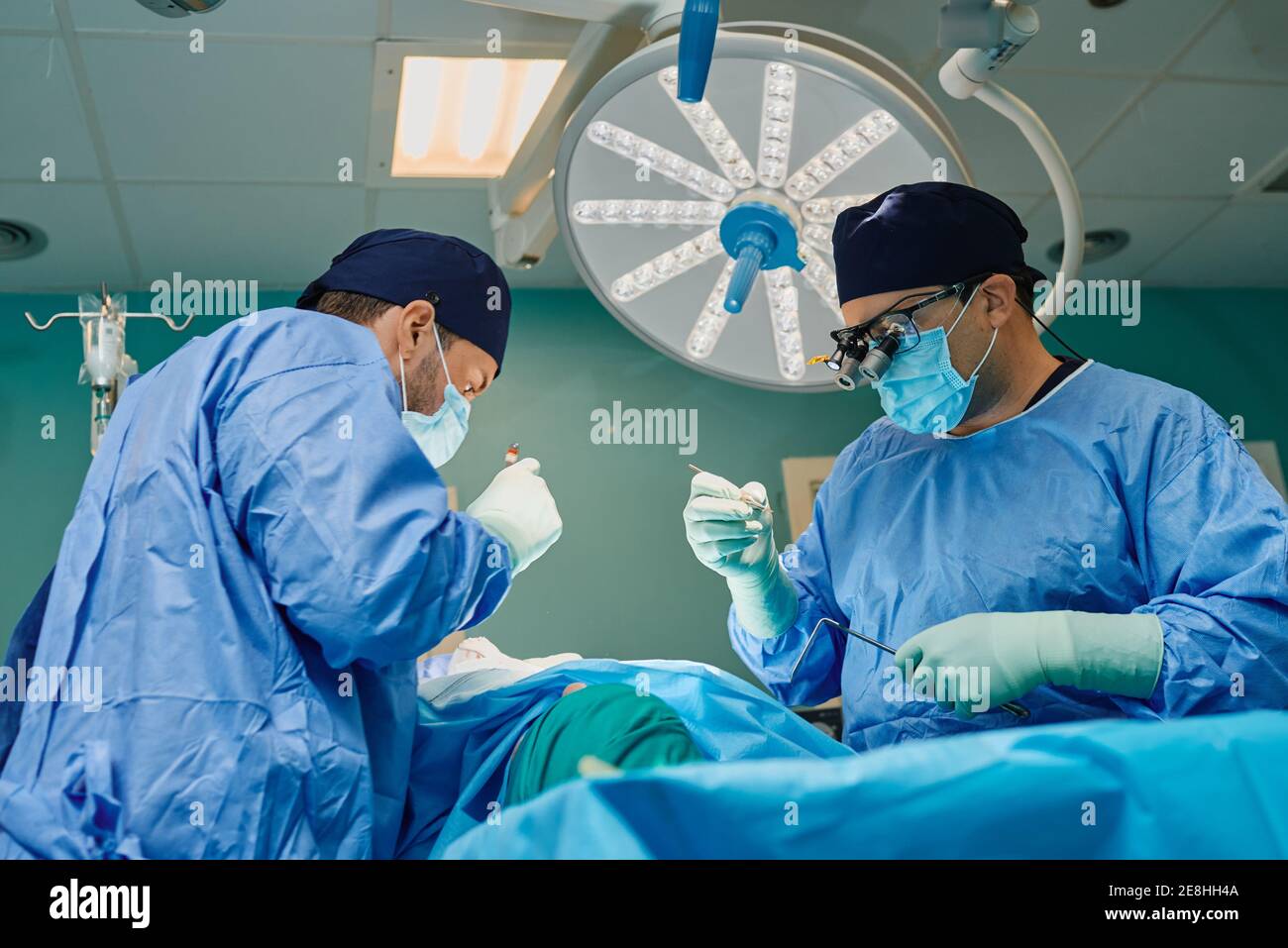 Patient lying on an operating table hi-res stock photography and images ...