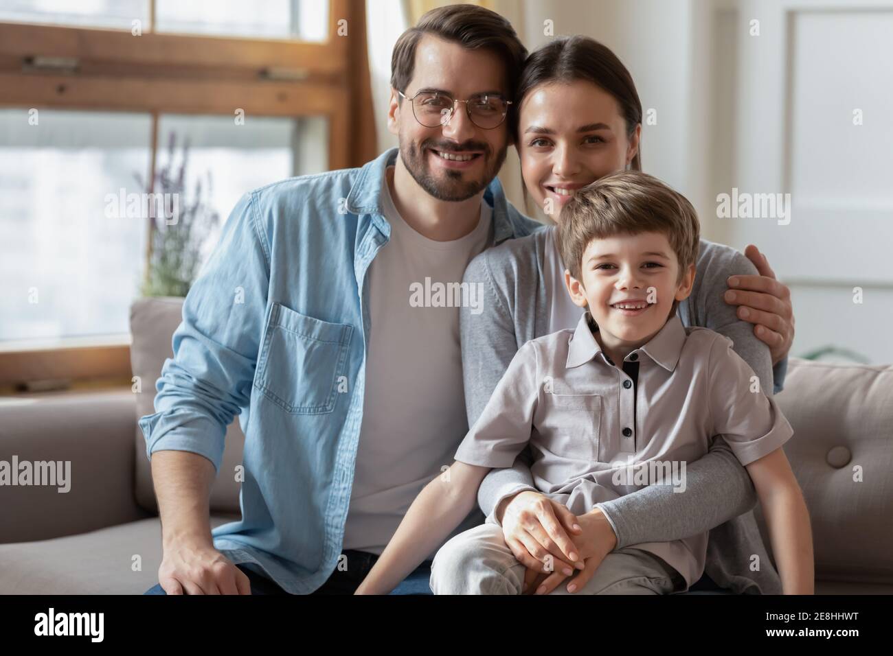 Portrait of happy family with small son Stock Photo - Alamy