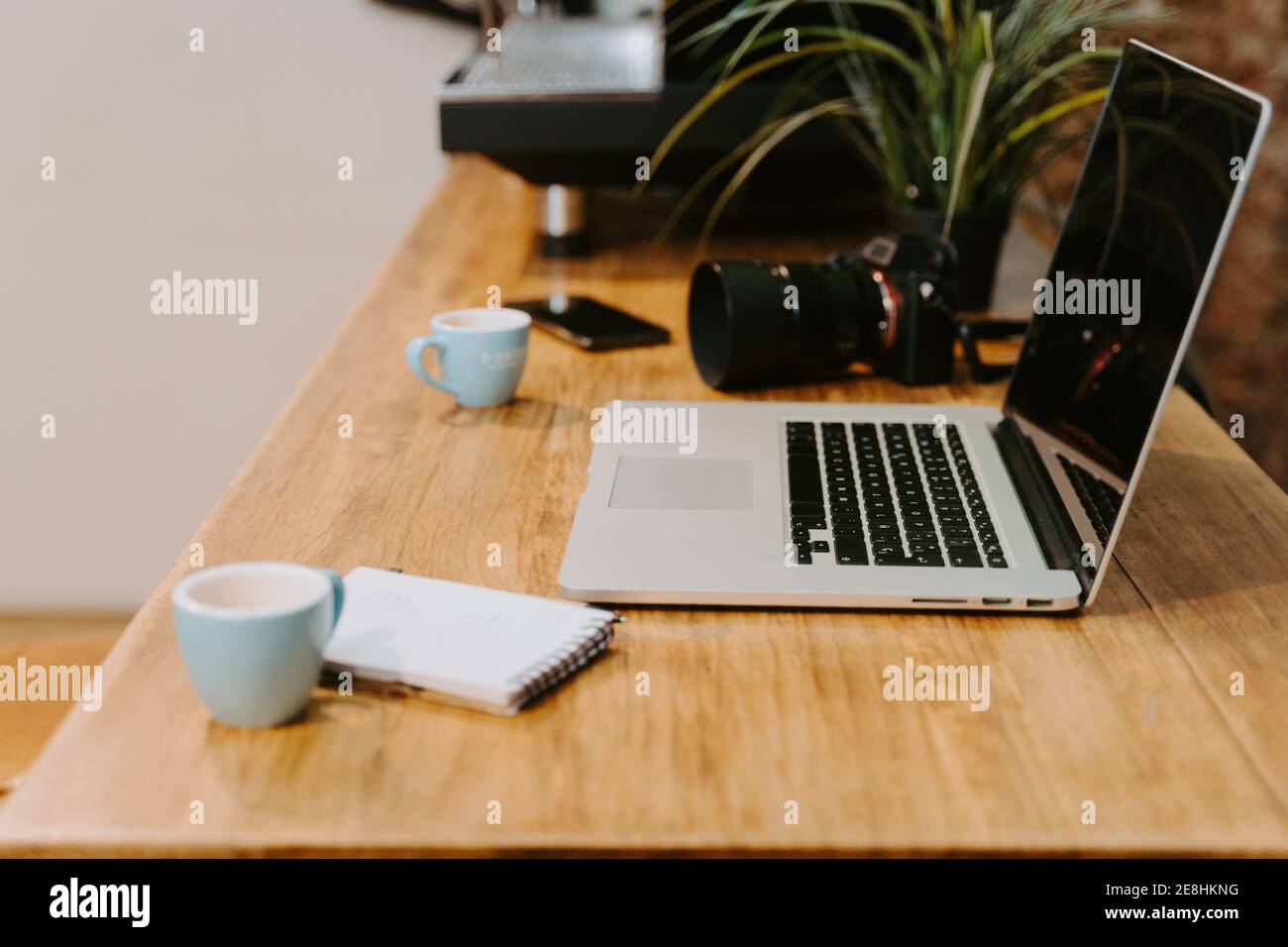 Workplace of freelancer with modern netbook and professional photo ...