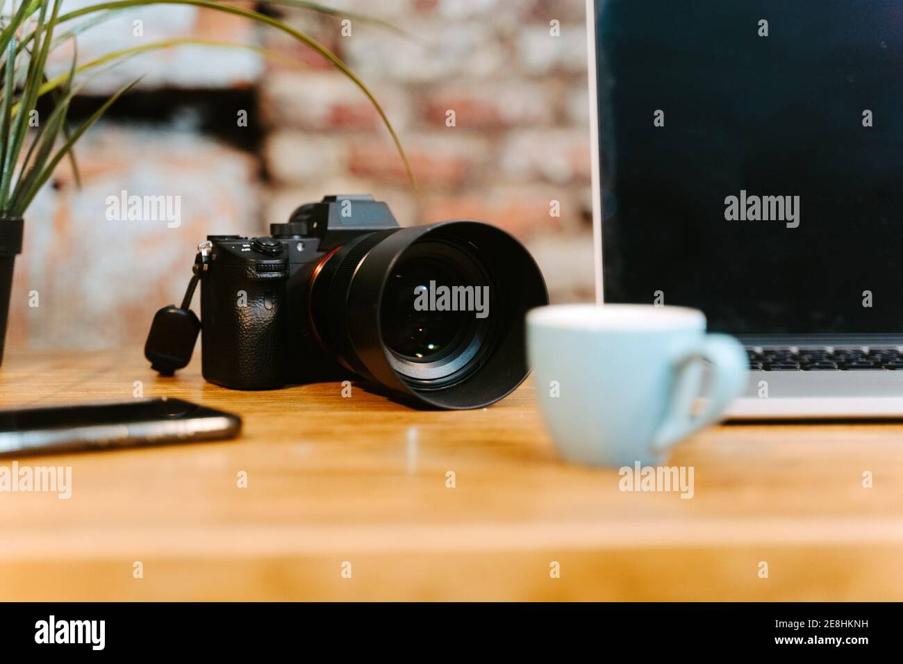 Workplace of freelancer with modern netbook and professional photo ...