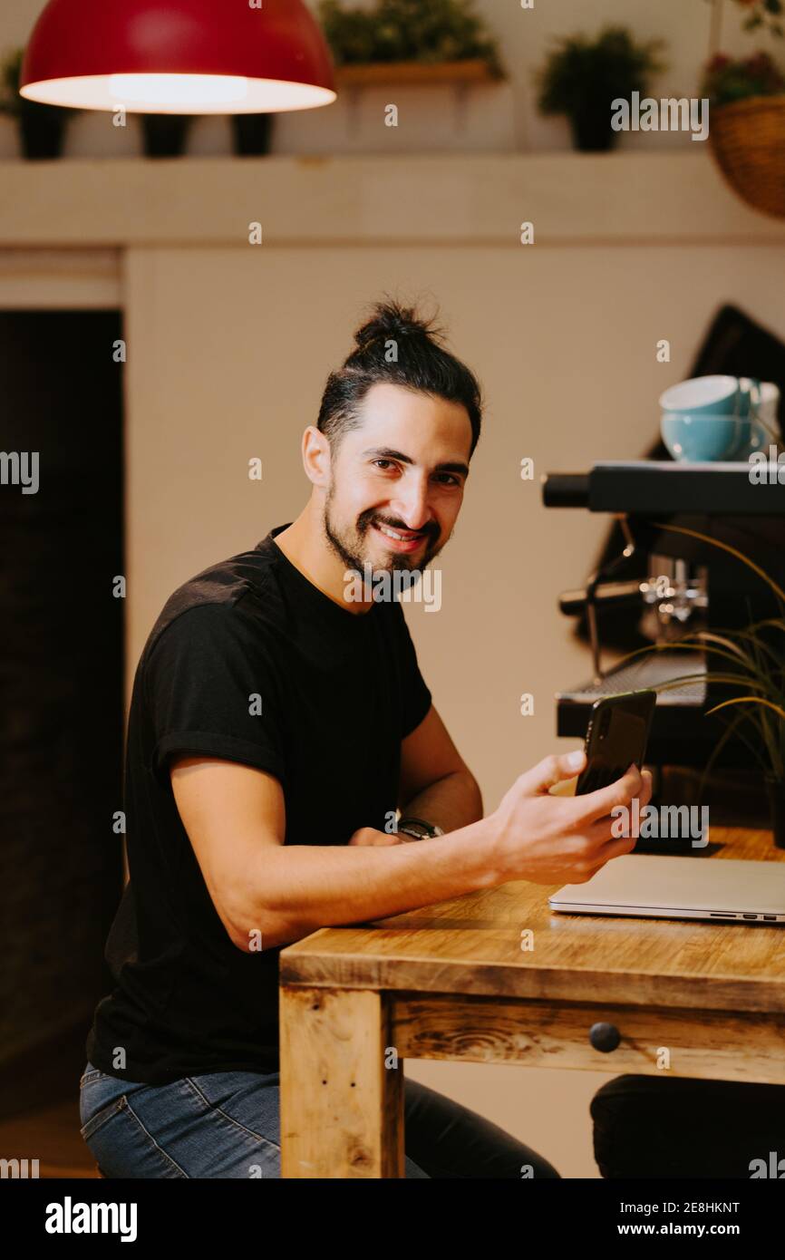 Happy barista in coffee shop hi-res stock photography and images - Alamy