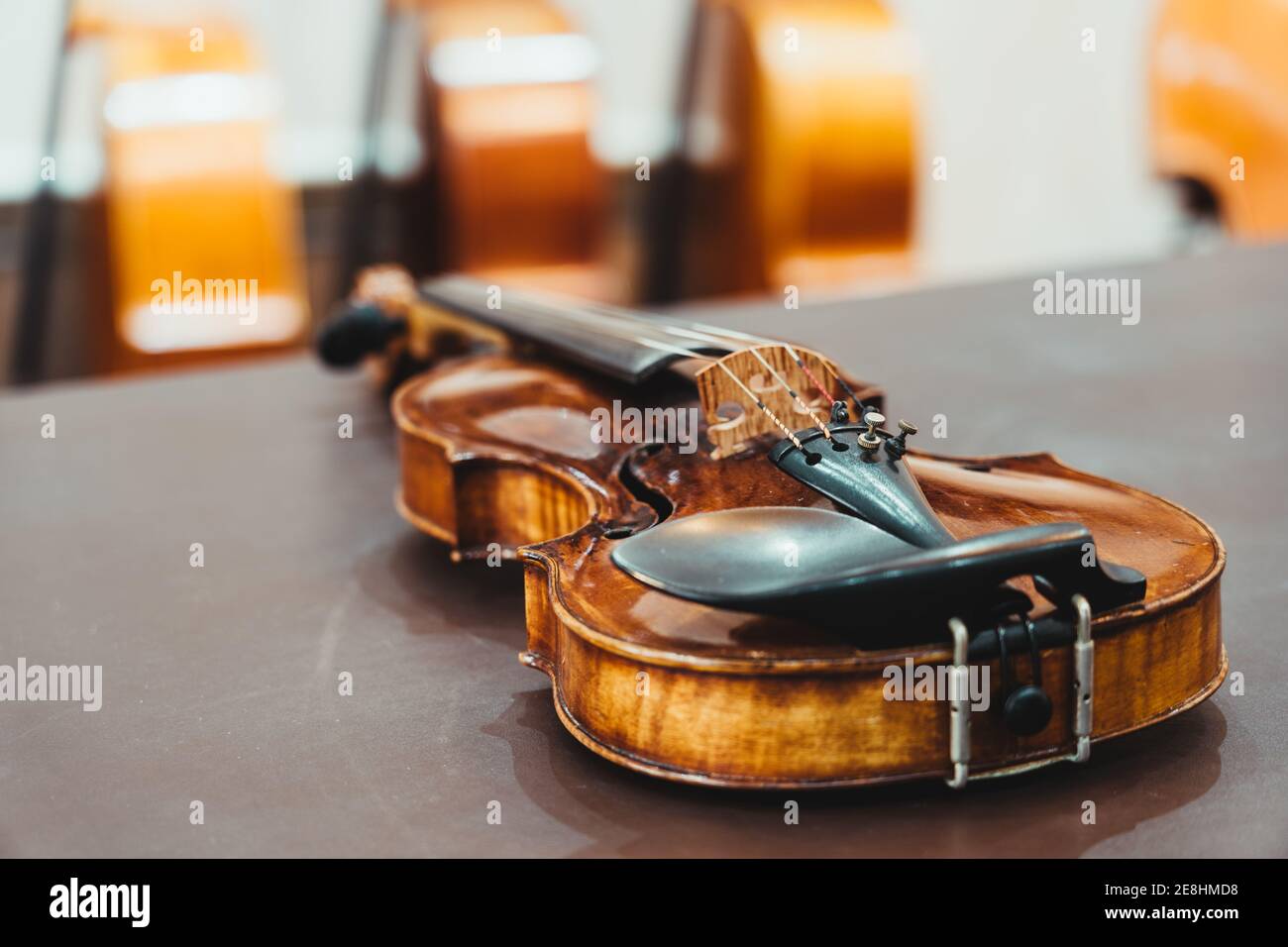 From above of modern shiny violin placed on shabby wooden table in ...