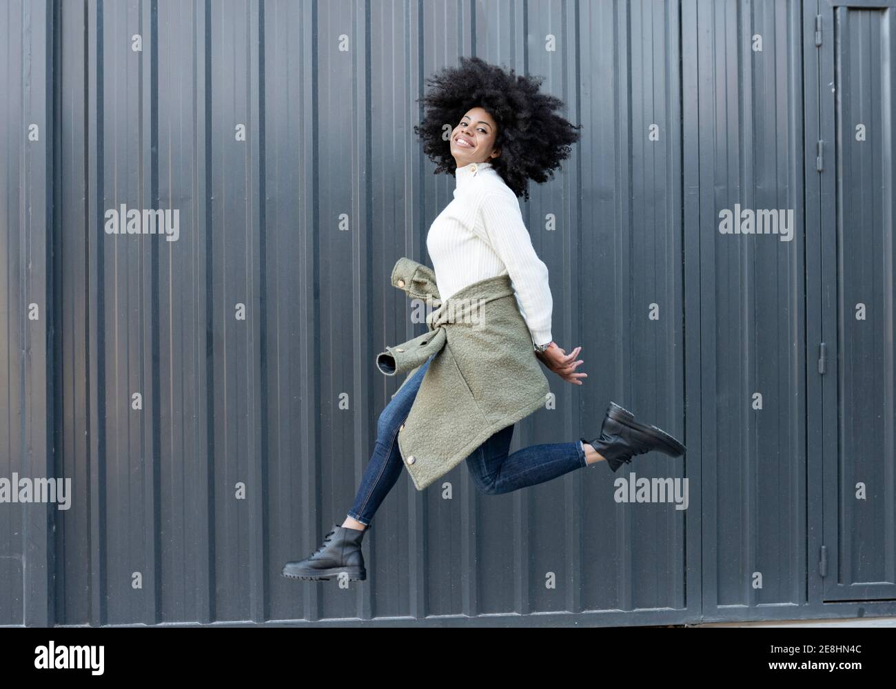 Full body young african woman jump hi-res stock photography and images ...