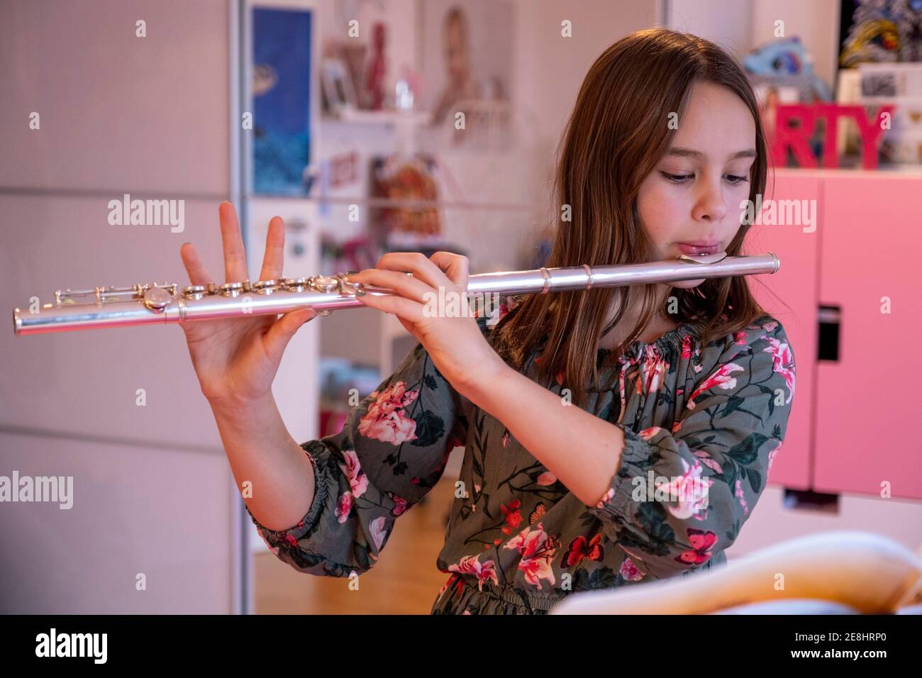Girl playing flute, learning musical instrument, Bavaria, Germany Stock ...
