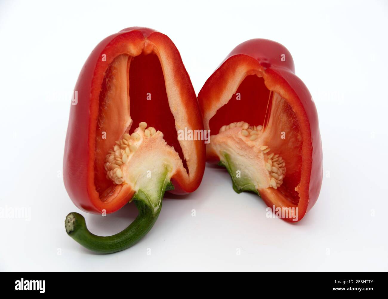 Two halves of red bell pepper in a cut on a white background Stock ...