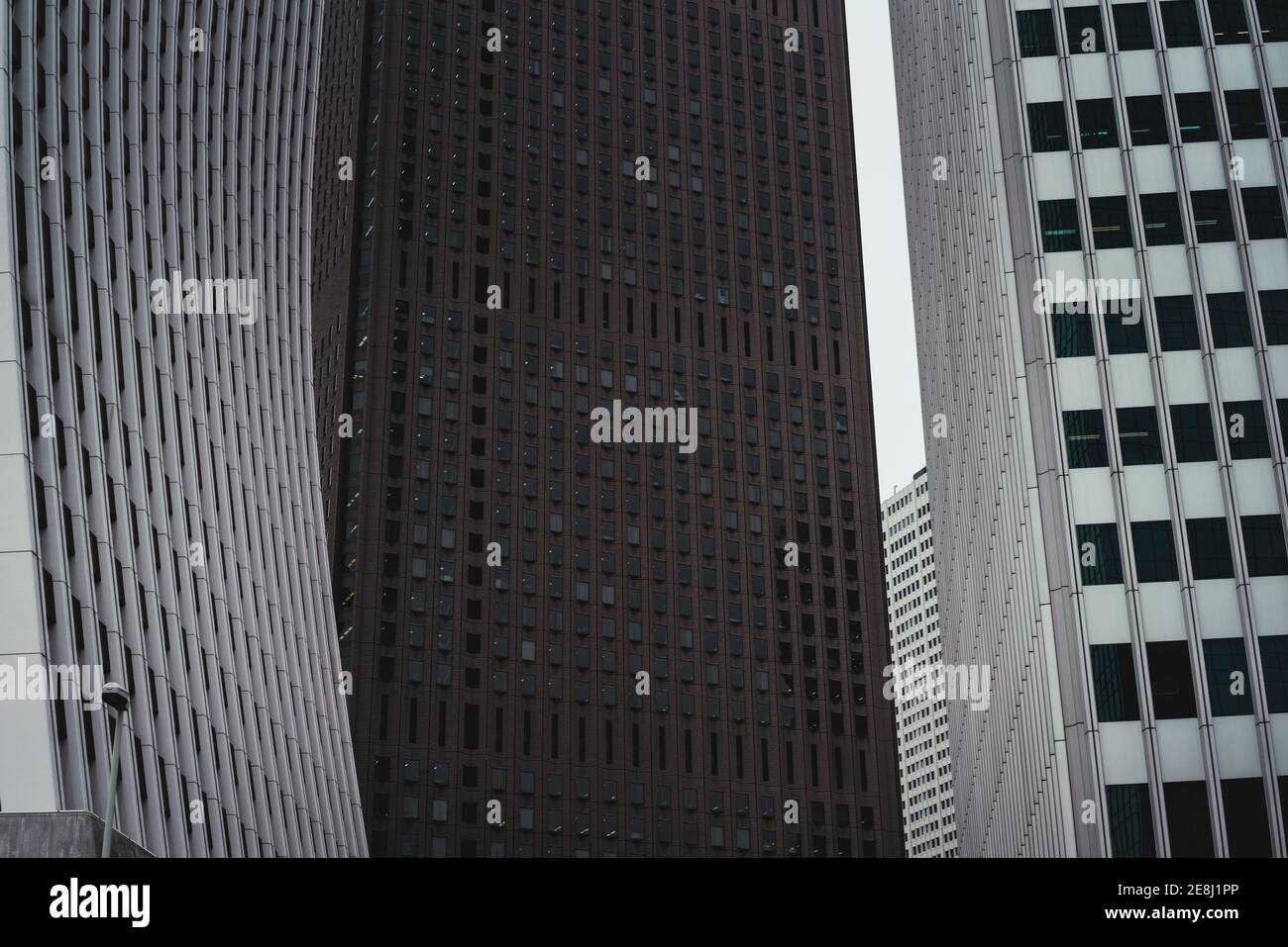 View to high skyscrapers towers and small buildings in big city Stock ...