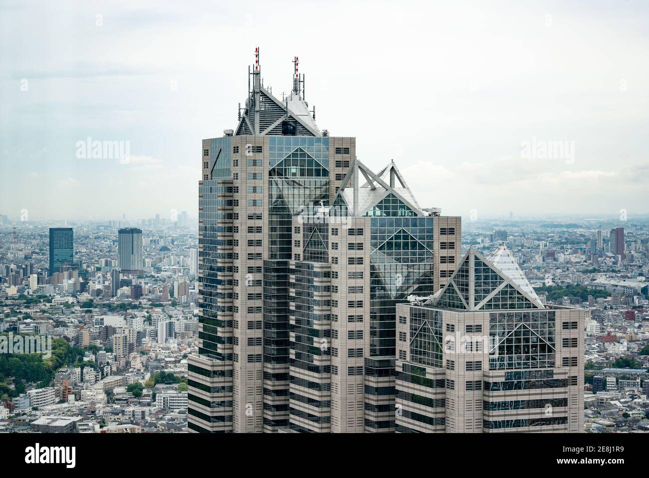 View to high skyscrapers towers and small buildings in big city Stock ...