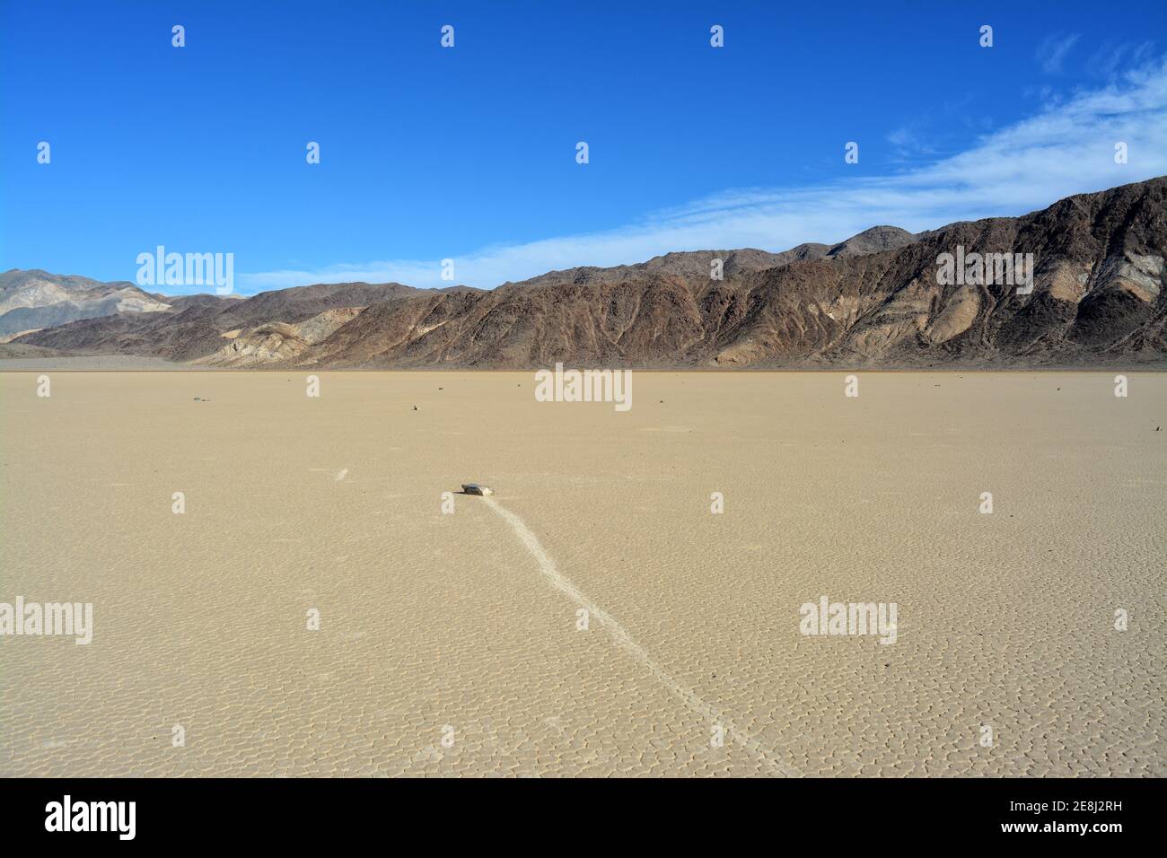 sailing rock leaving a long trail in the desert of the Racetrack Playa ...