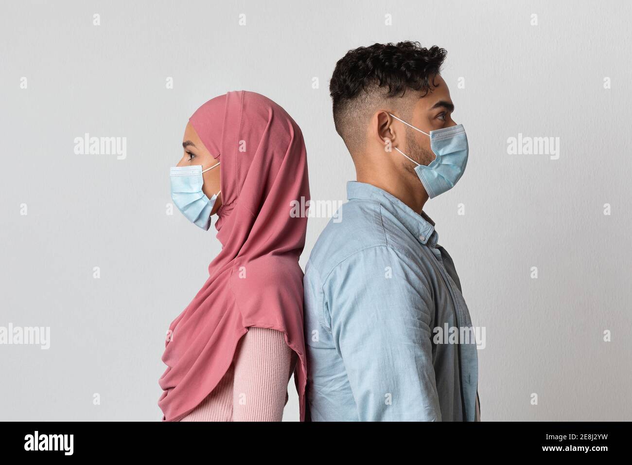 Coronavirus Concept. Young Muslim Couple Wearing Medical Masks Standing ...
