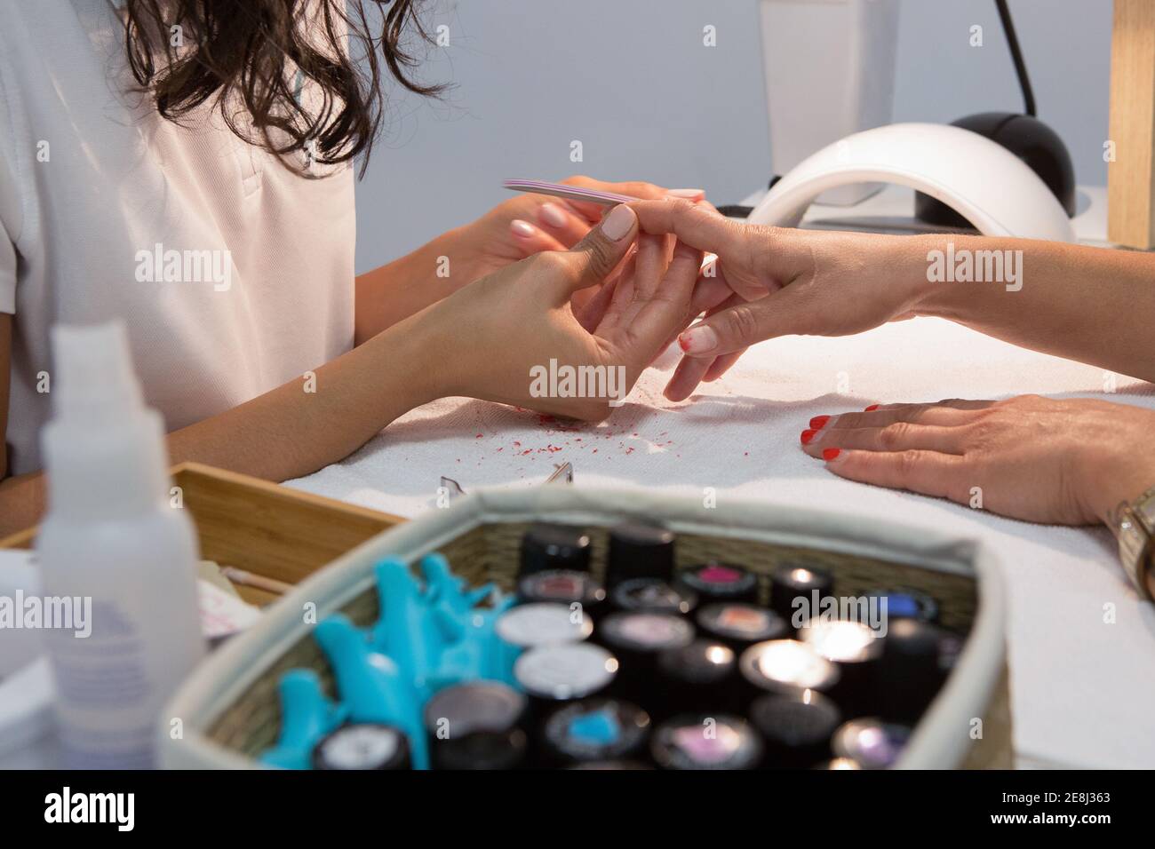 From above of crop anonymous beauty master trimming nail of Woman with ...