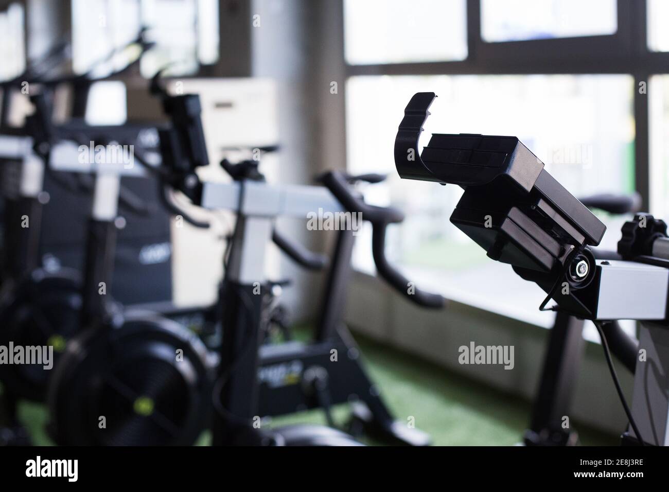 Stationary bicycles for intense functional workout placed in row in ...