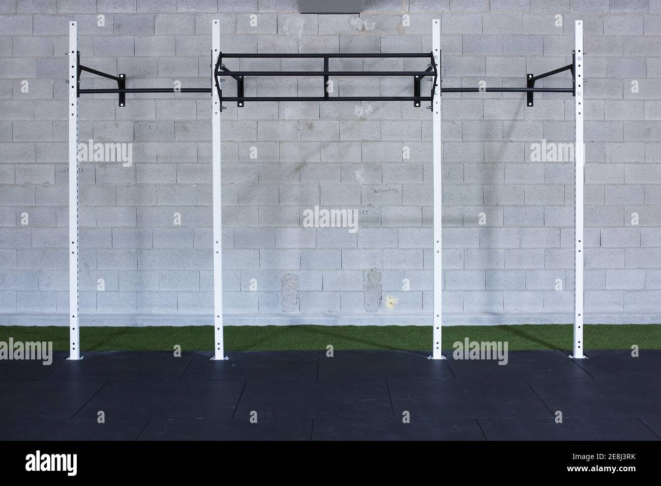Interior of modern empty gym with metal horizontal bars installed for ...
