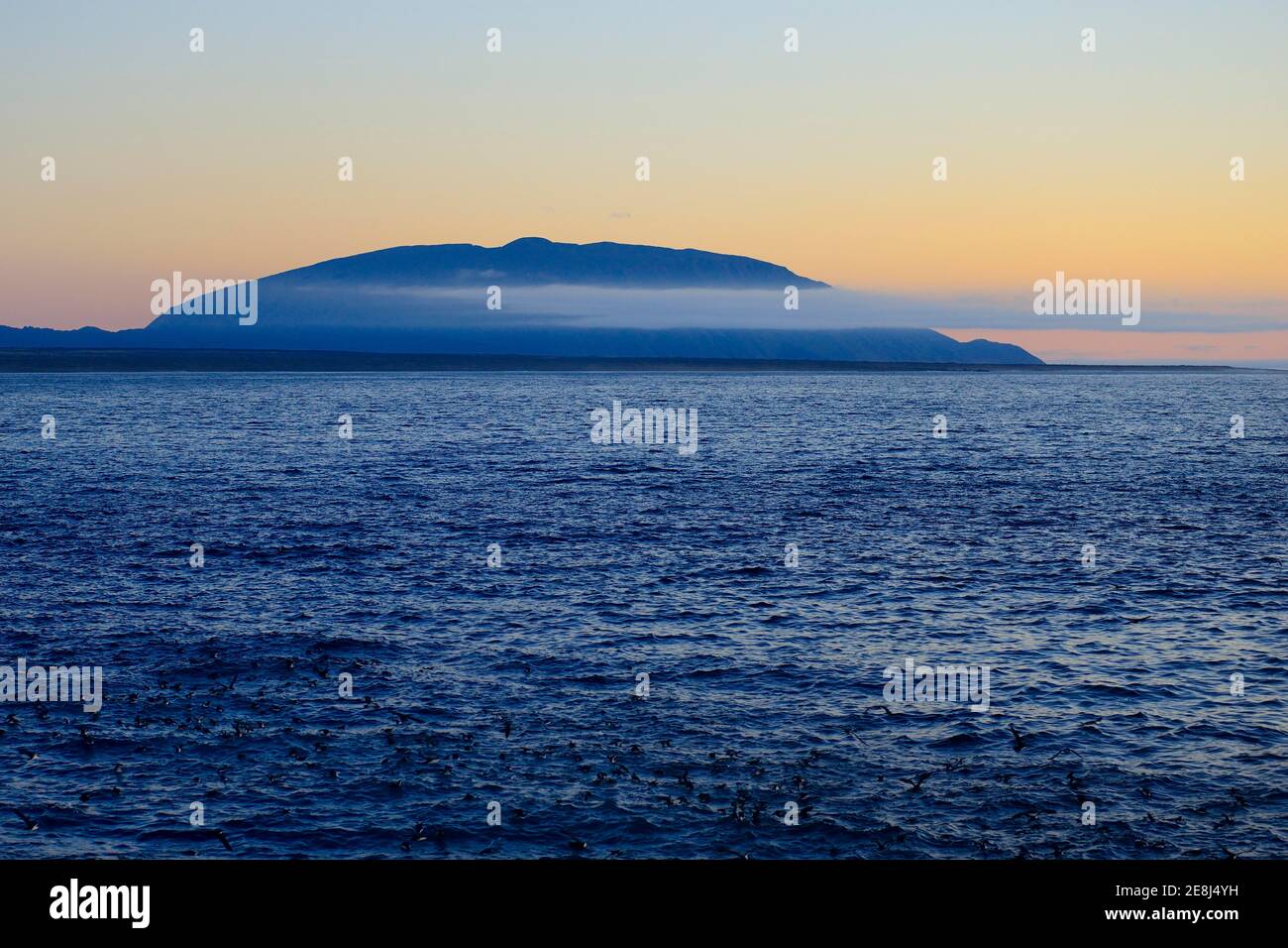 Ecuador volcano at sunset, Isabela Island, Galapagos, Ecuador Stock ...