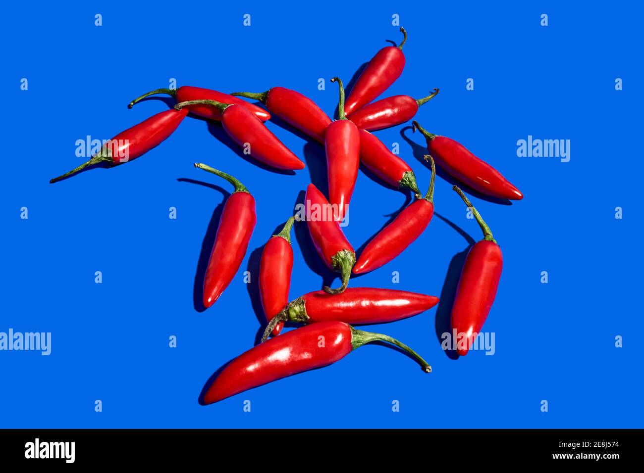 Top view composition with red fresh exotic peppers used as spice or ...