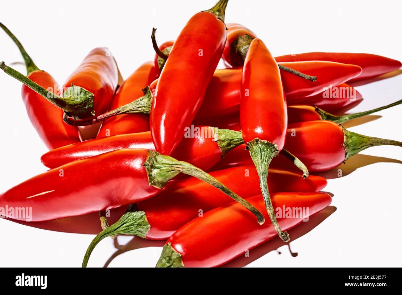 Top view composition with red fresh exotic peppers used as spice or ...