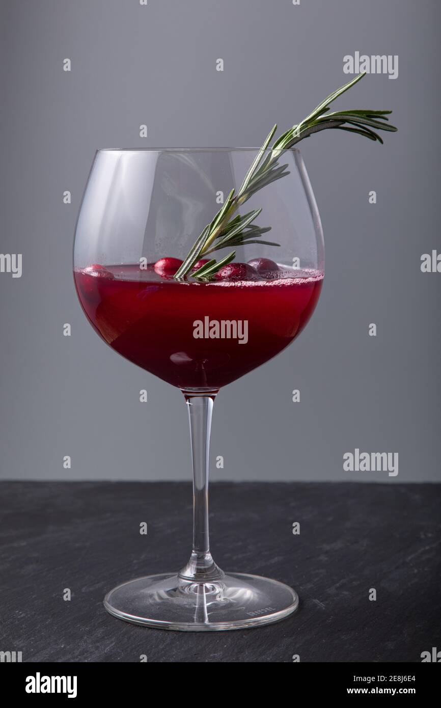 Cranberry cocktail on black surface Stock Photo - Alamy