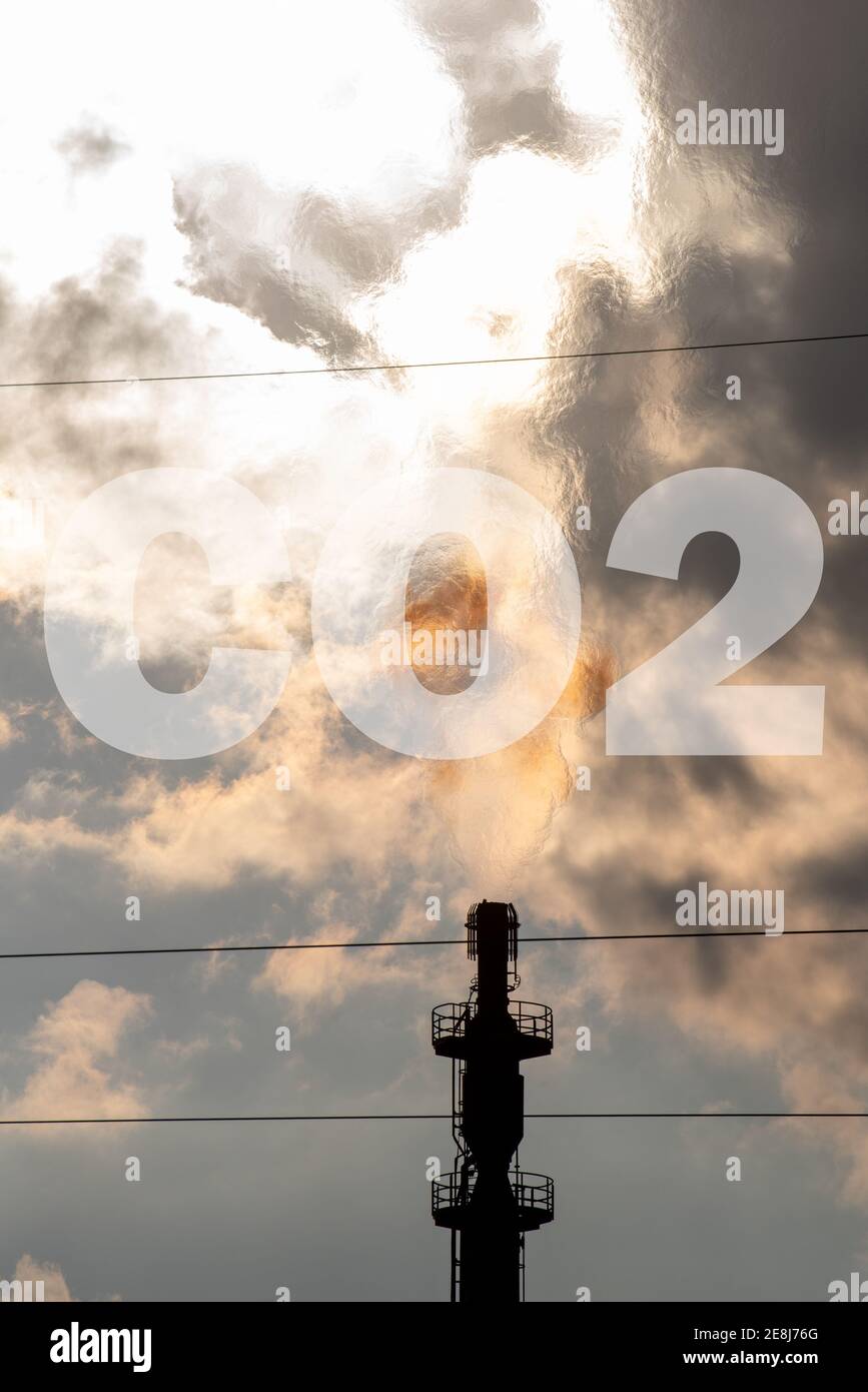 A vertical shot of an industrial chimney with CO2 emissions Stock Photo ...