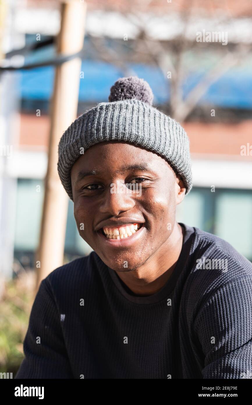 Cheerful African American male with toothy smile wearing casual clothes ...