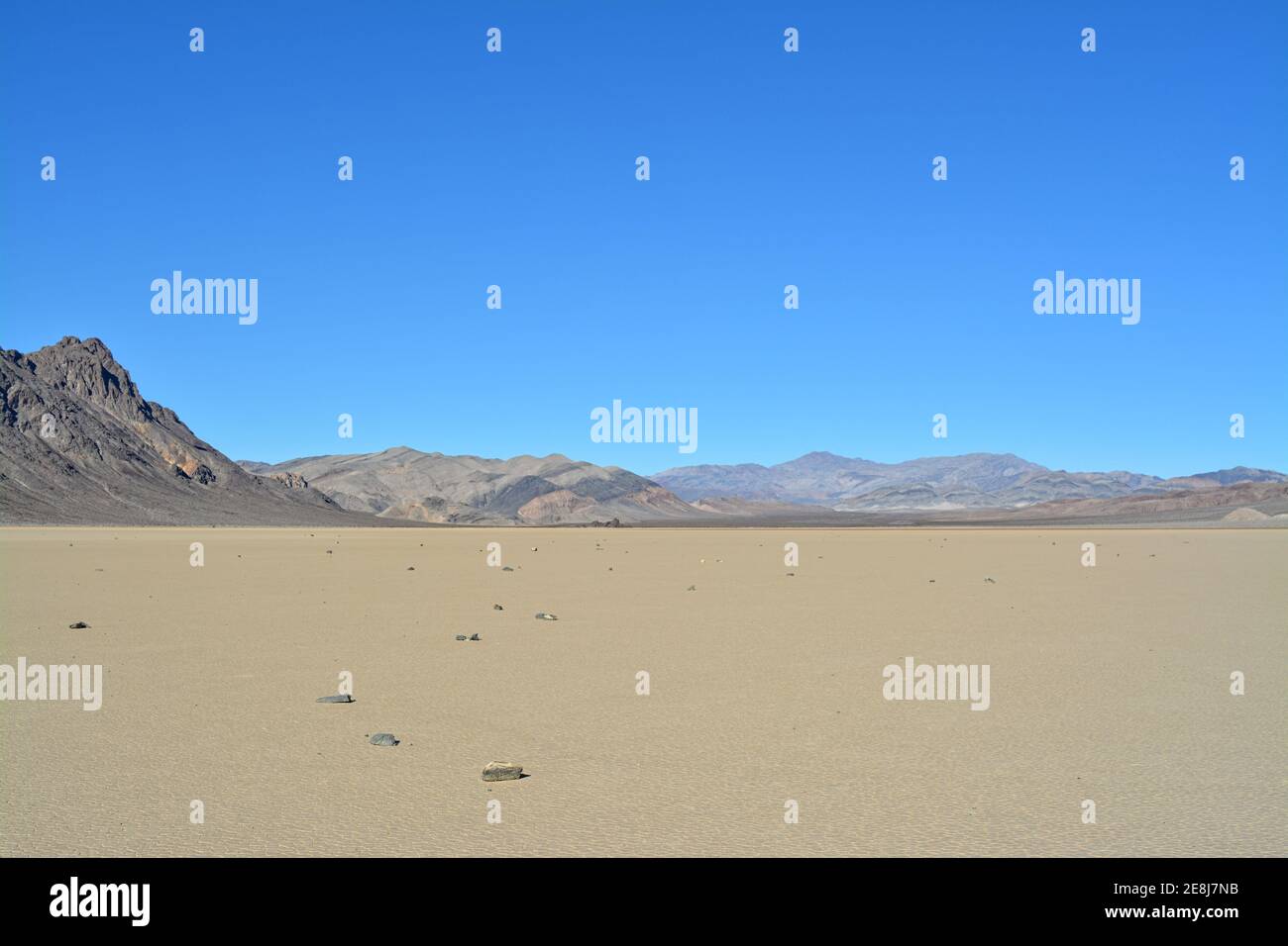 sailing rock leaving a long trail in the desert of the Racetrack Playa ...