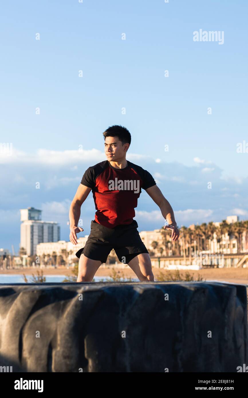 Athletic male performing intense jump hi-res stock photography and ...