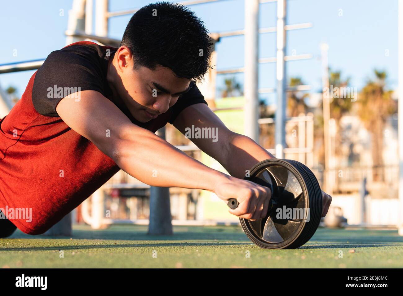 Side view of of unrecognizable strong sporty male athlete exercising ...