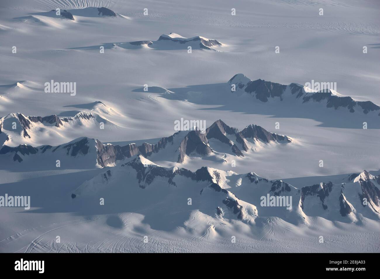 Aerial view, inland ice with glaciated mountain ranges, Greenland Stock ...