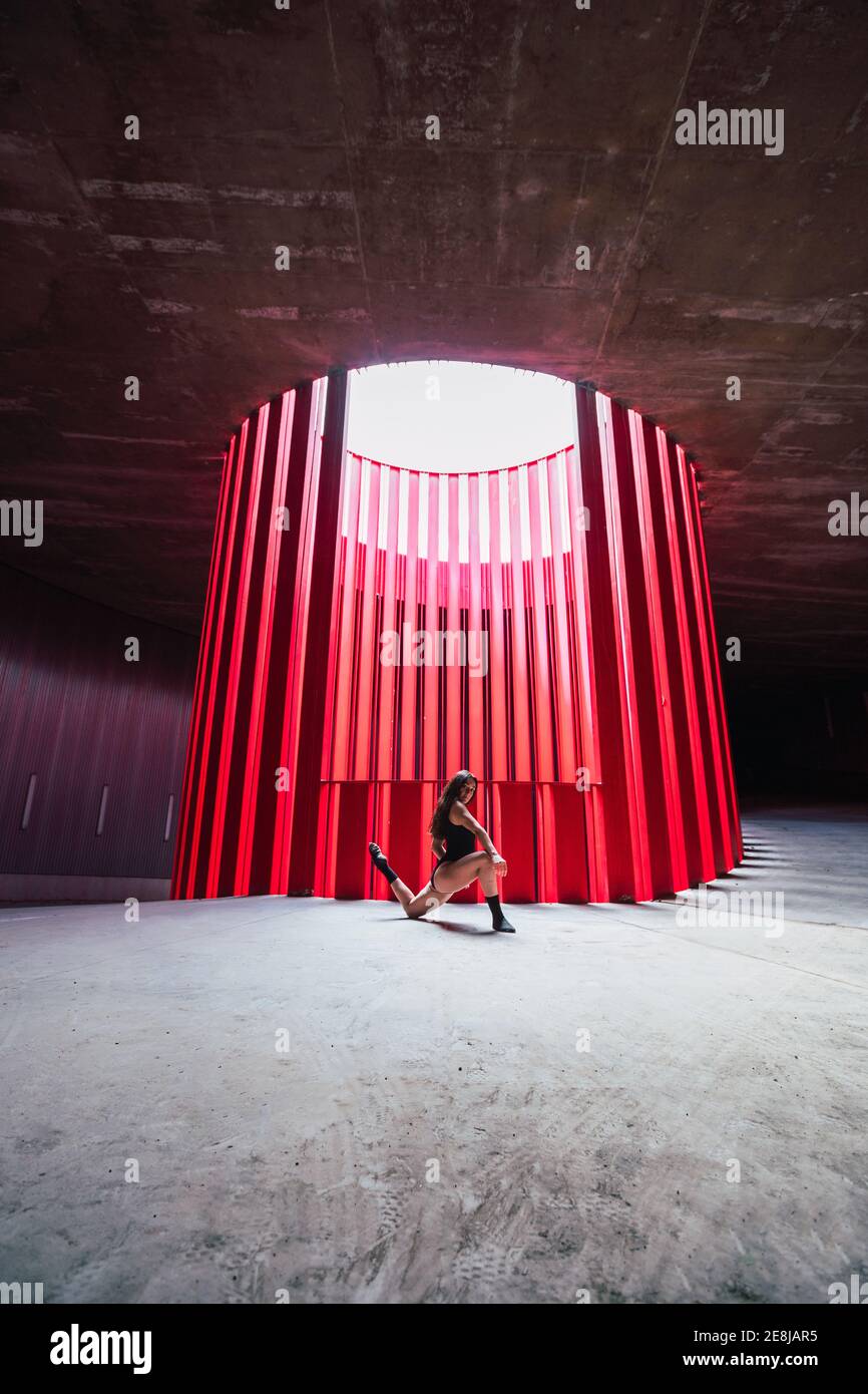 Side view of female theater artist performing on stage in daytime ...