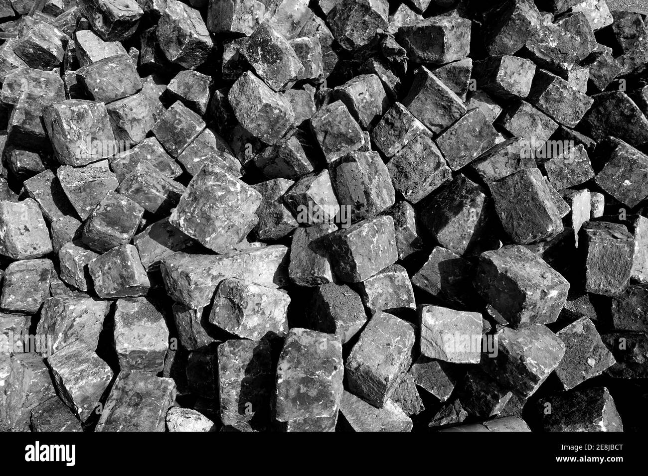 A top view greyscale shot of a pile of cement-made bricks Stock Photo ...