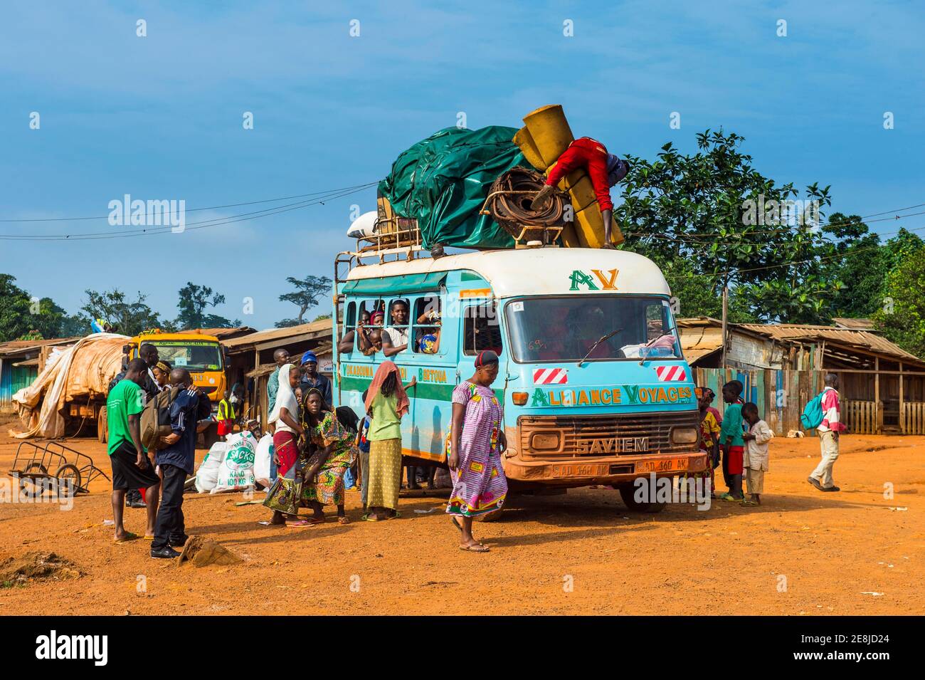 Fully loaded local bus in Libongo, deep in the jungle of Cameroon Stock ...
