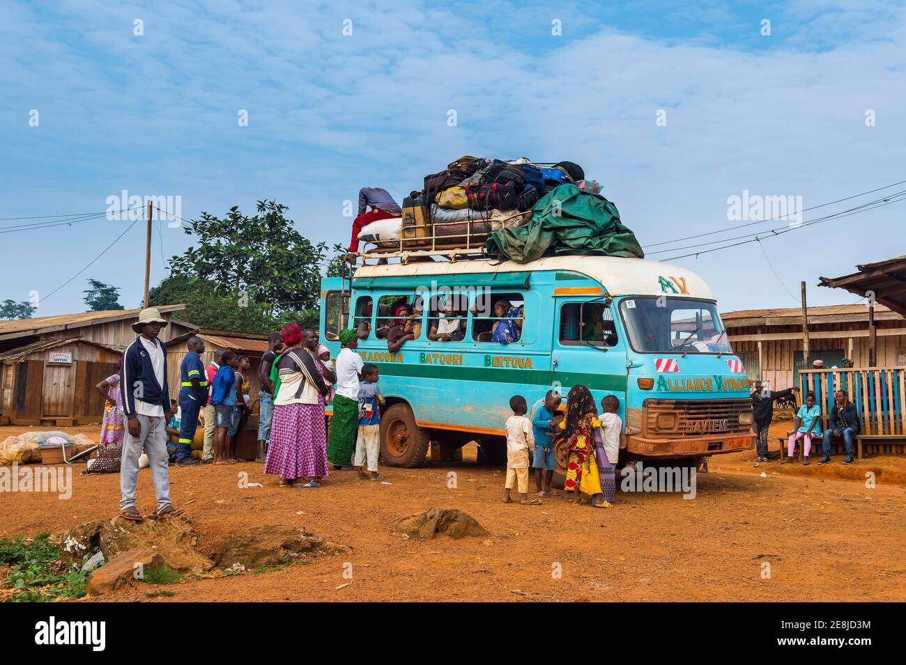 Fully loaded local bus in Libongo, deep in the jungle of Cameroon Stock ...
