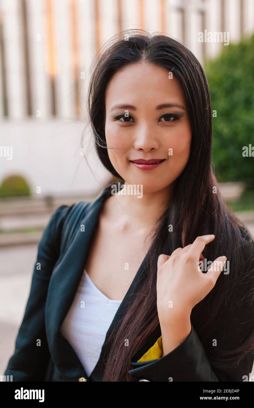 Delighted ethnic female entrepreneur wearing smart casual clothes ...