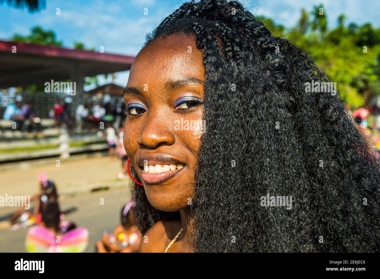 Girl posing at the Carneval in the town of Sao Tome, Sao Tome and ...