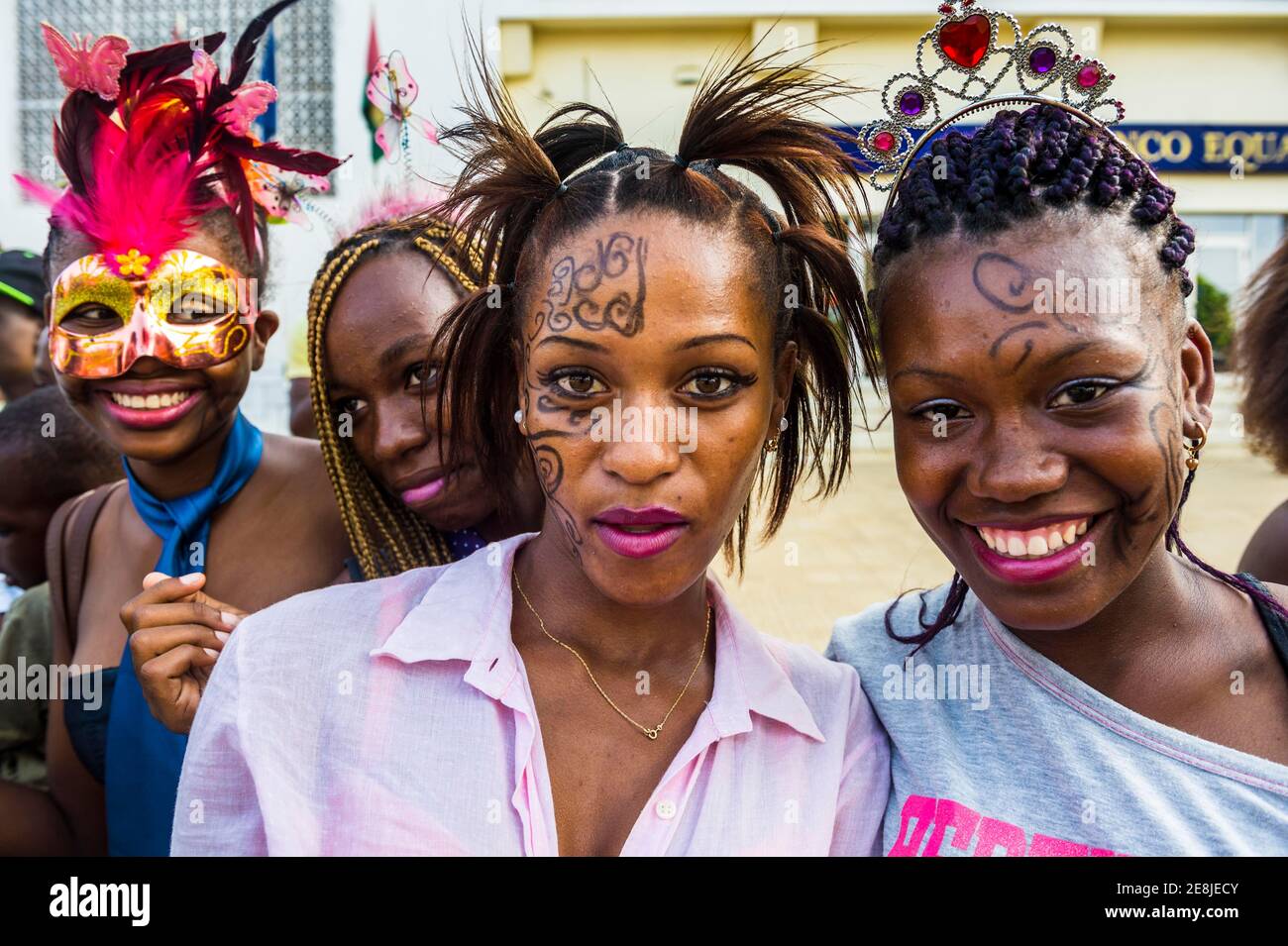 Happy girls posing at the Carneval in the town of Sao Tome, Sao Tome ...