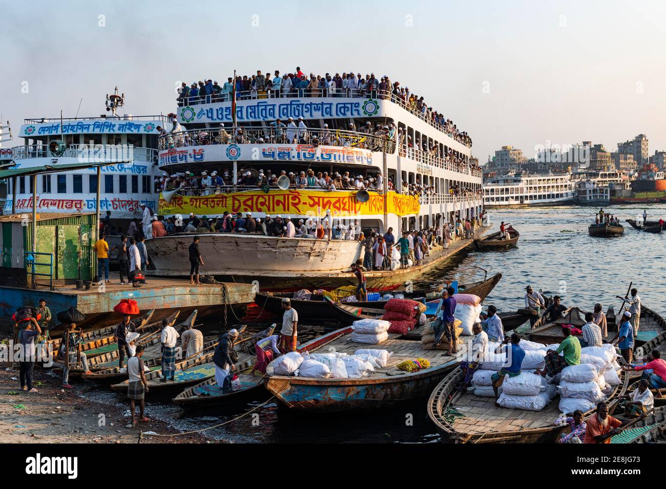 Overloaded passenger ferry with pilgrims on the Dhaka river, Port of ...