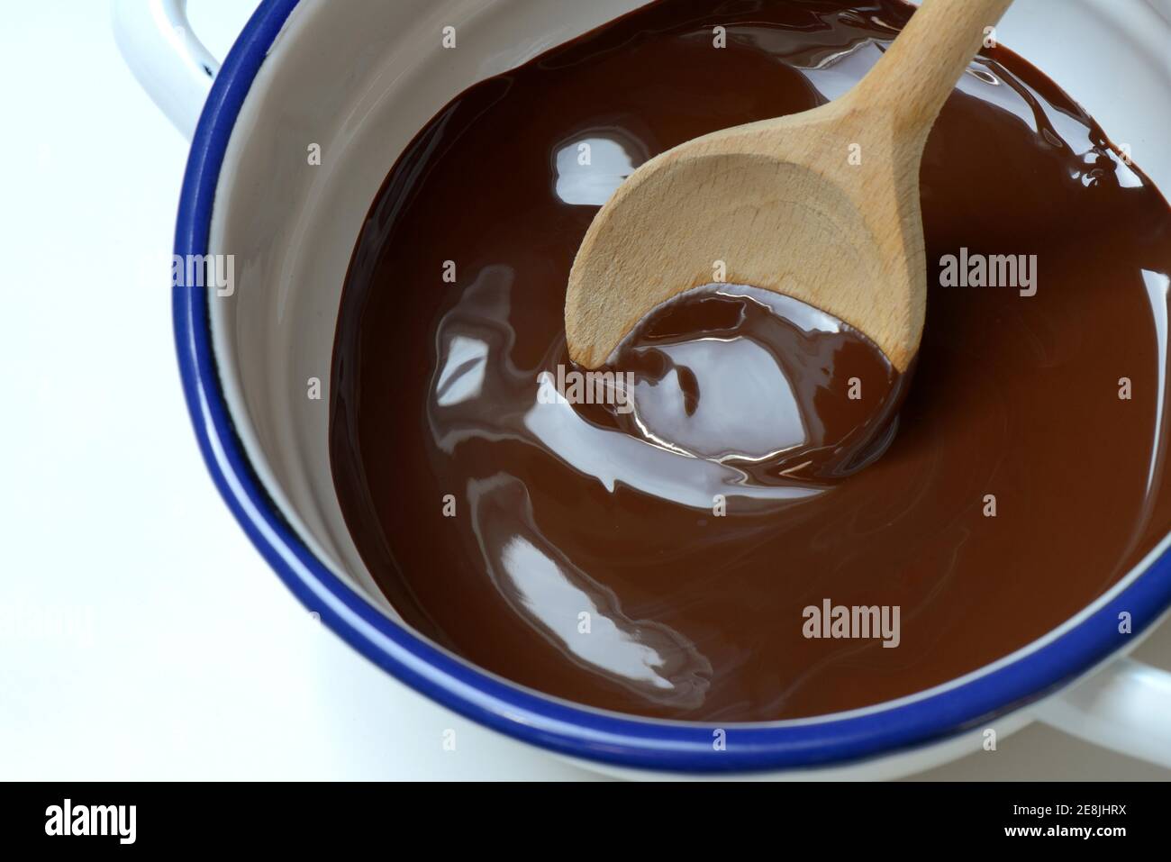 Couverture, melted block chocolate with cooking spoon Stock Photo - Alamy