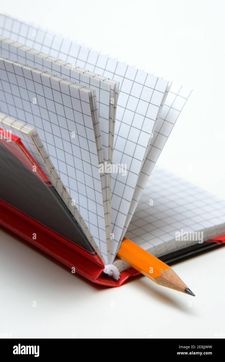 Pencil in notebook Stock Photo - Alamy