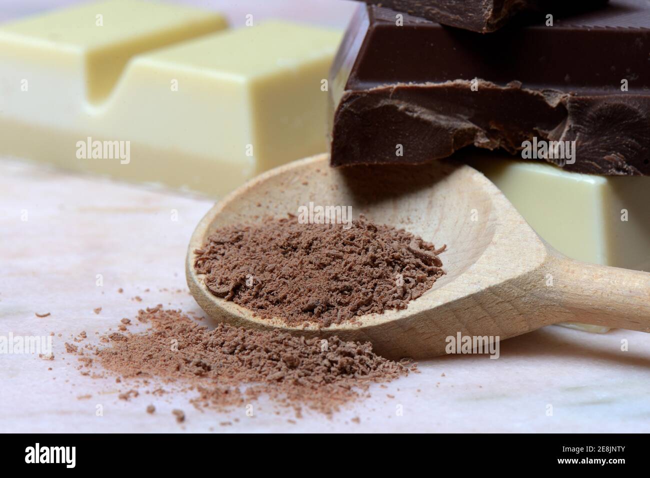 Grated chocolate blocks in cooking spoon, chocolate Stock Photo - Alamy
