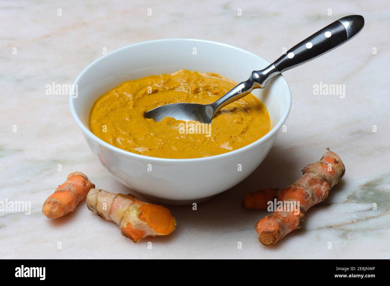 Turmeric paste in shell and turmeric root, turmeric longa, turmeric ...