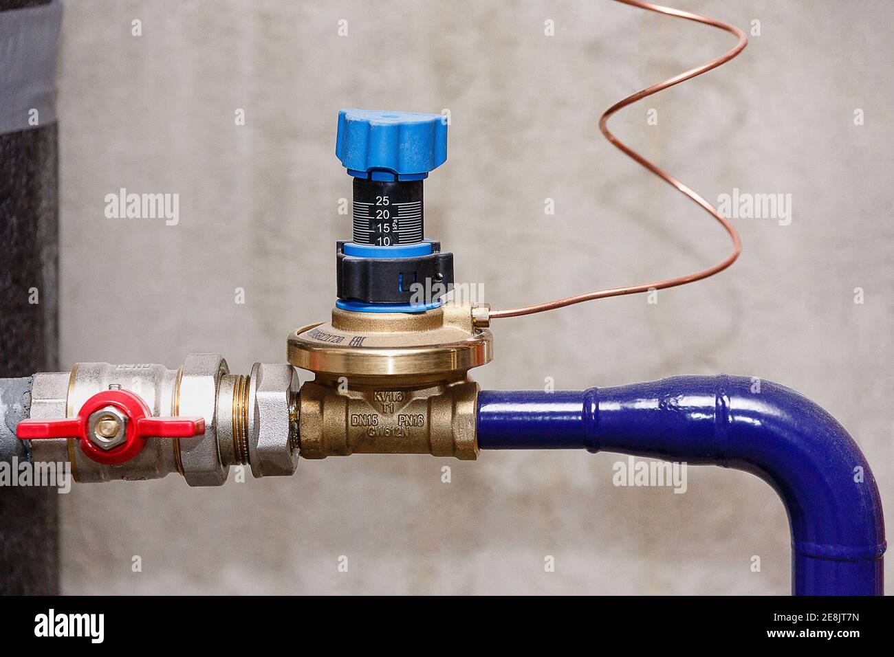 Water supply system node on the background of a concrete wall, close-up ...