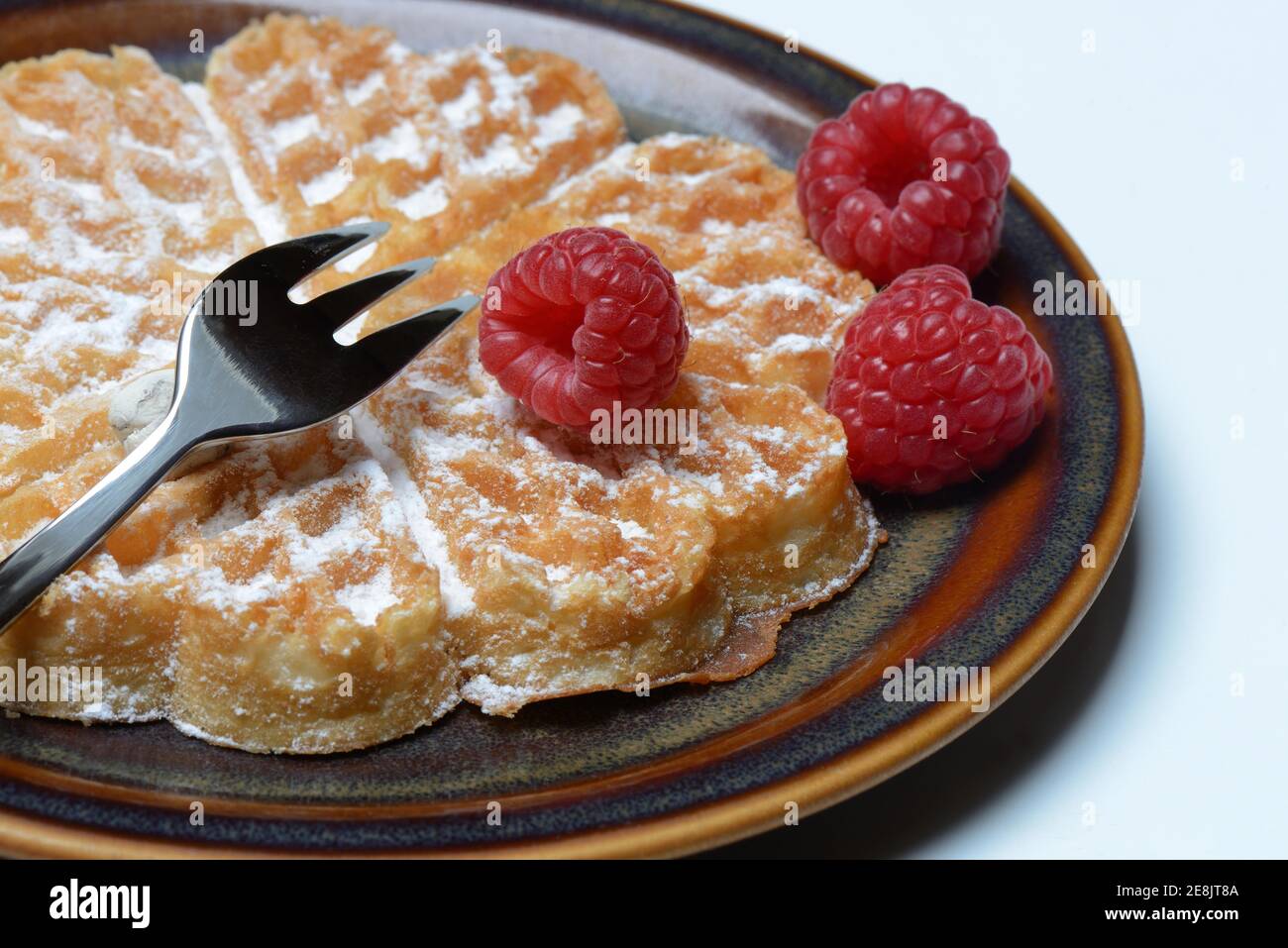 Waffle, Waffle with raspberries and fork Stock Photo - Alamy
