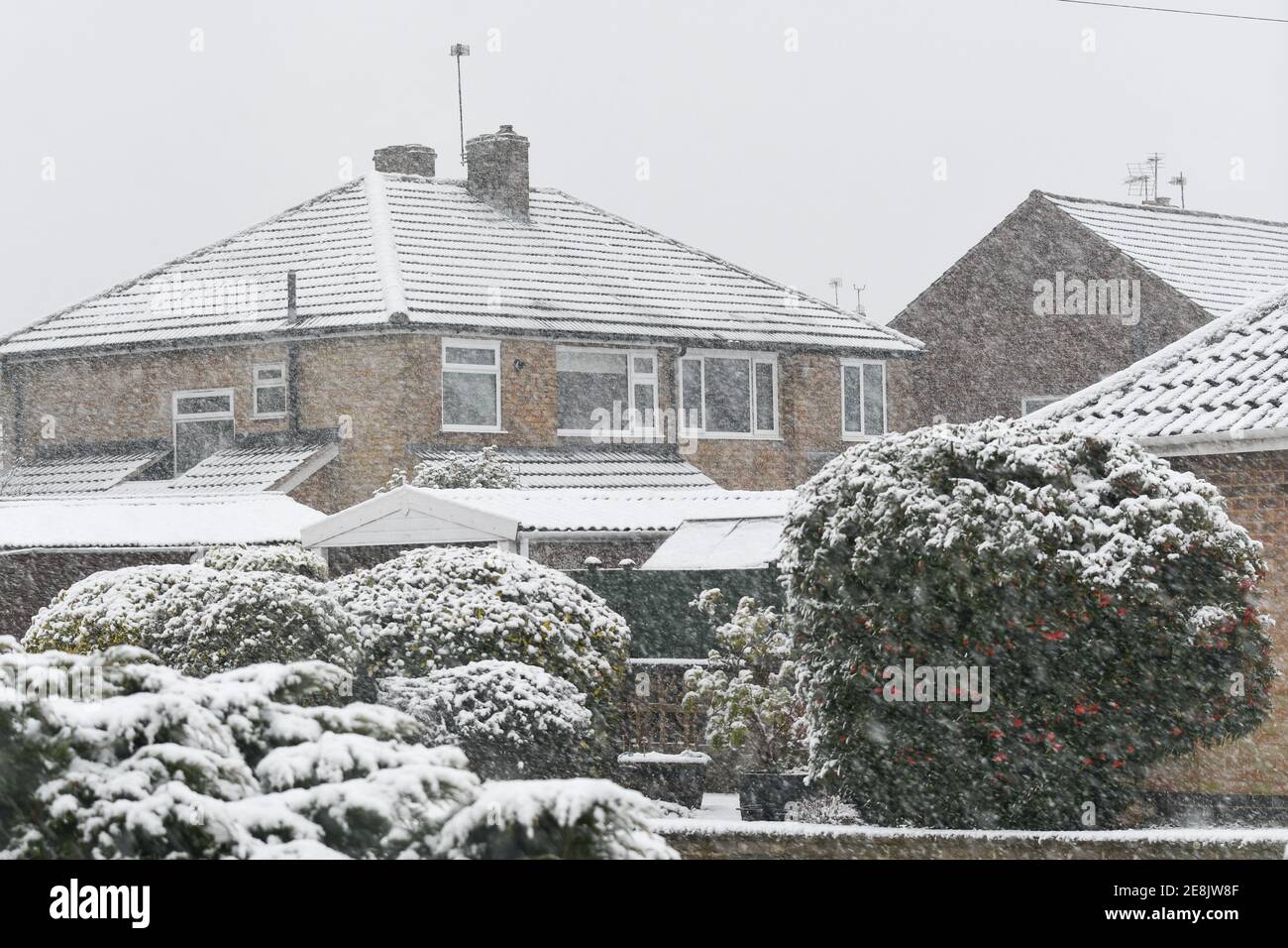 house covered in snow during a snowstorm Stock Photo - Alamy