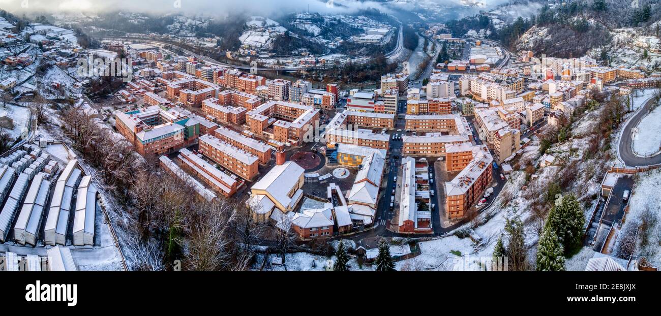 Aerial view of the Asturian town of Blimea under a snowfall, Spain ...