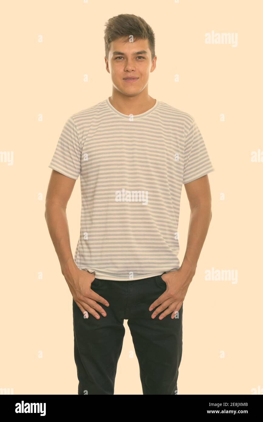 Studio shot of young handsome man standing Stock Photo - Alamy