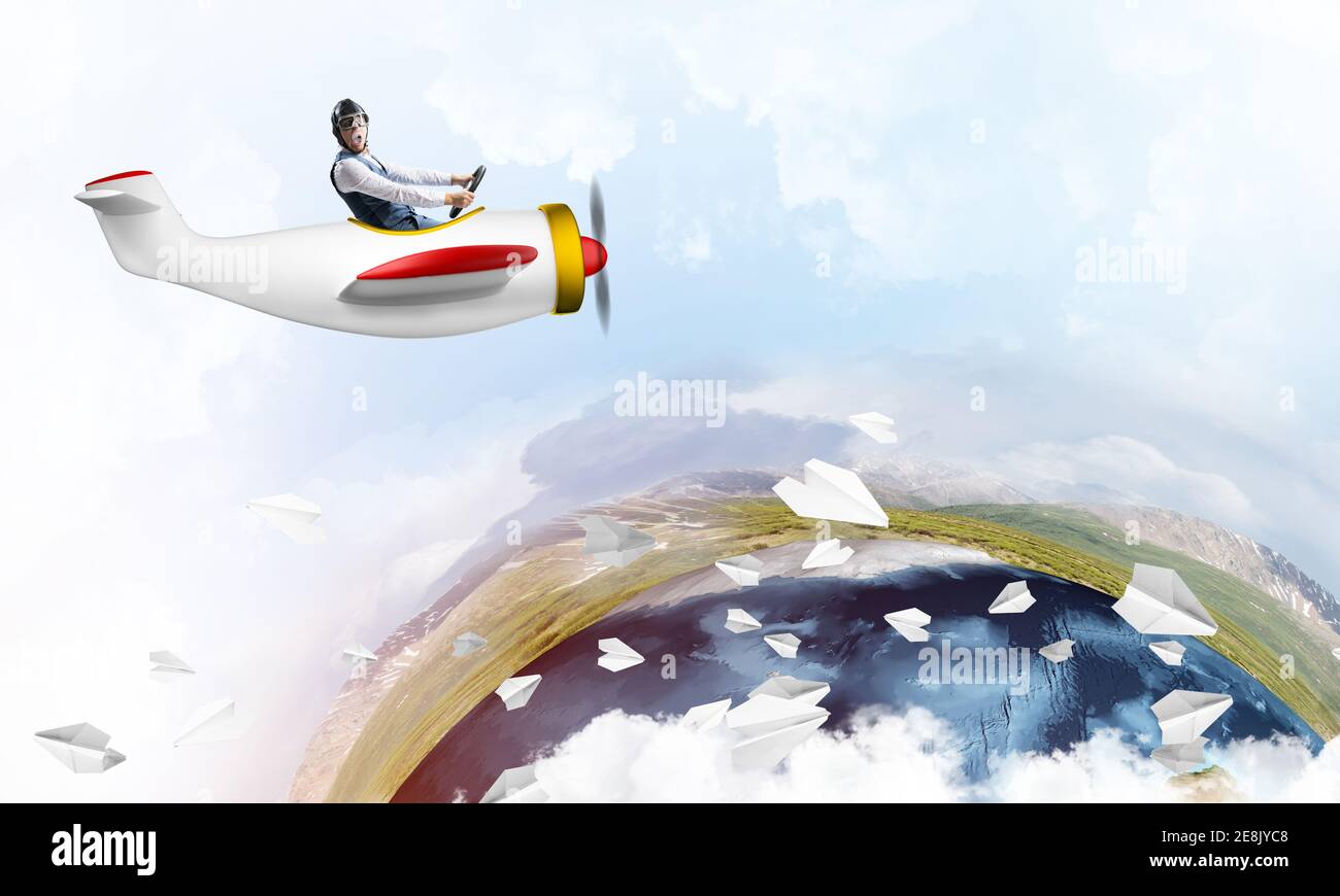 Pilot in leather helmet driving propeller plane Stock Photo - Alamy