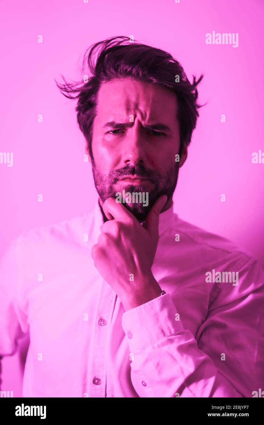 A vertical portrait of a handsome caucasian bearded young male looking ...